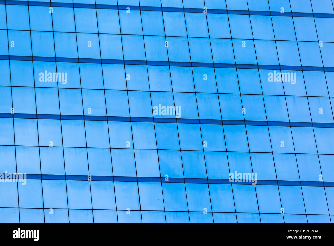 Blue glass windows of office building for background Stock Photo - Alamy
