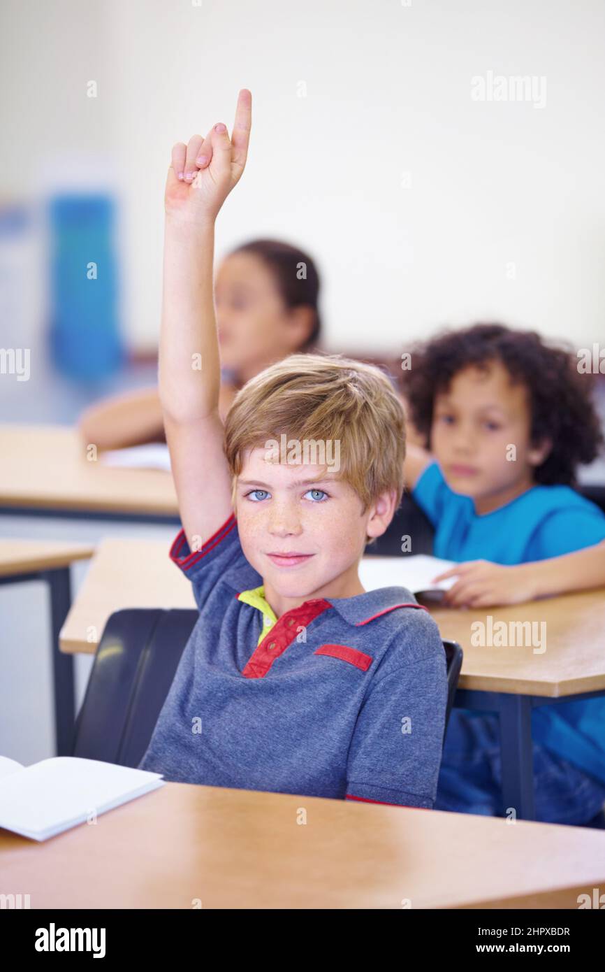 Hell answer your question. Portrait of a young boy holding his hand up ...
