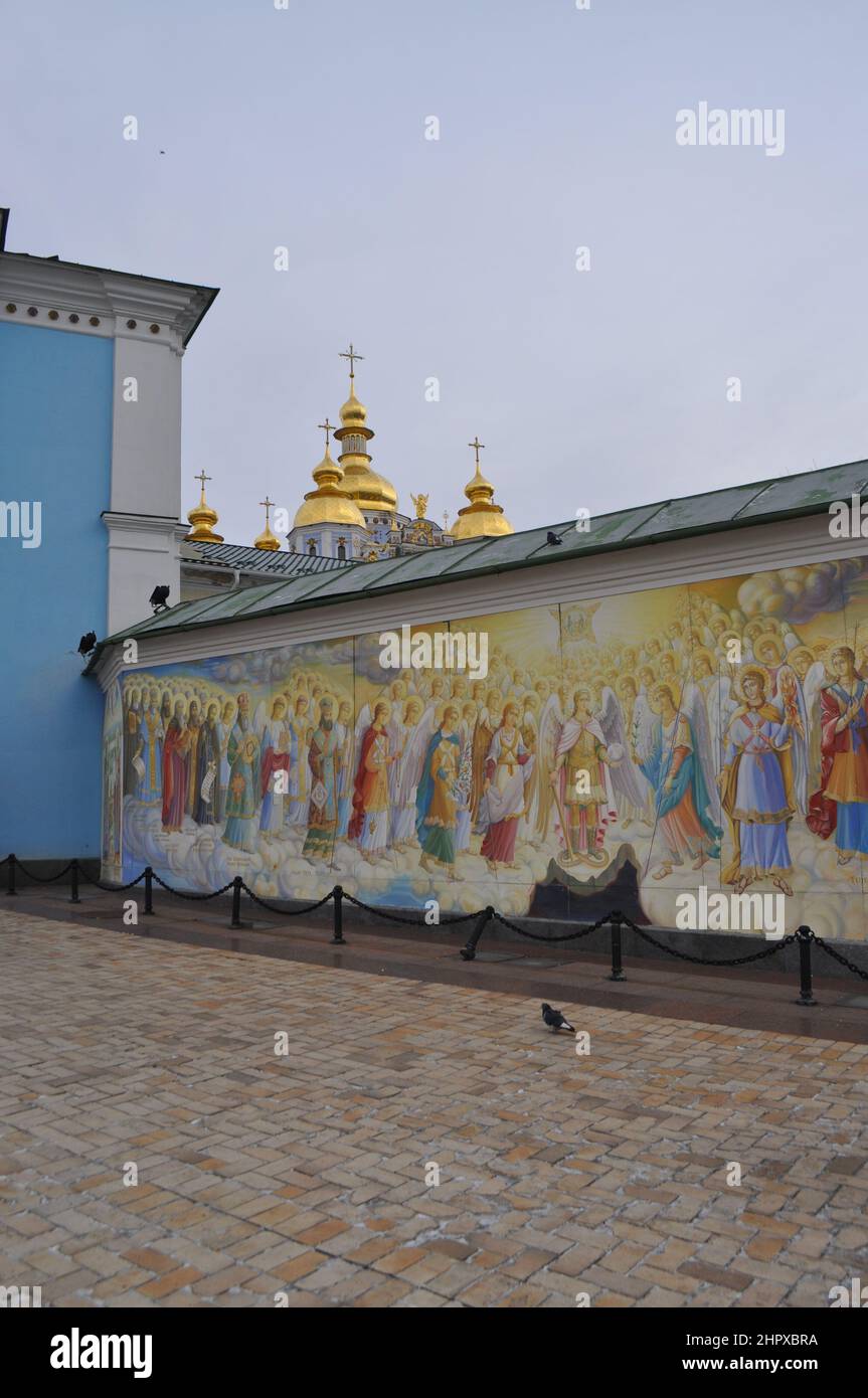 Painted religious mural featuring the Archangel Michael and other ...