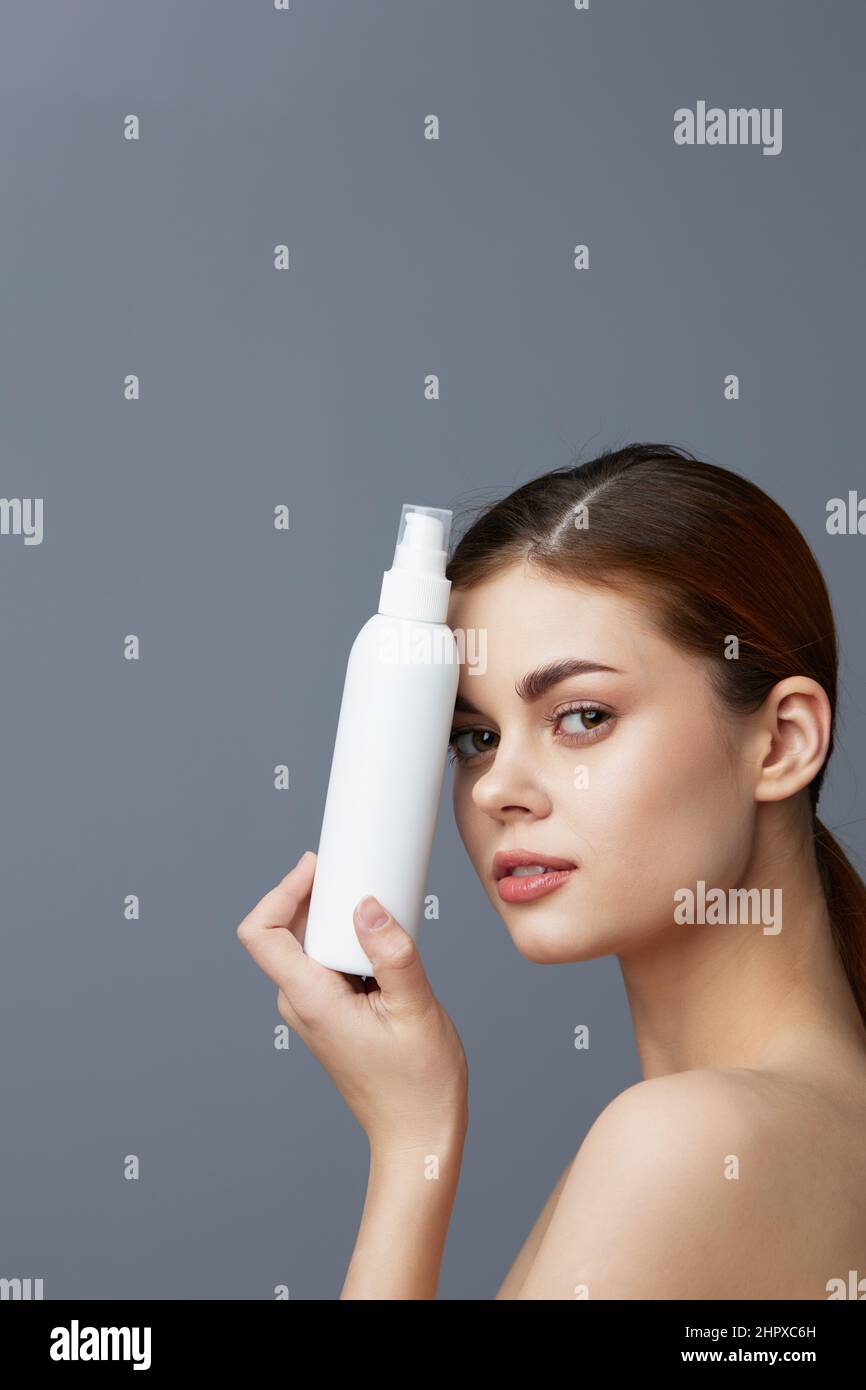 pretty woman body lotion rejuvenation cosmetics isolated background ...