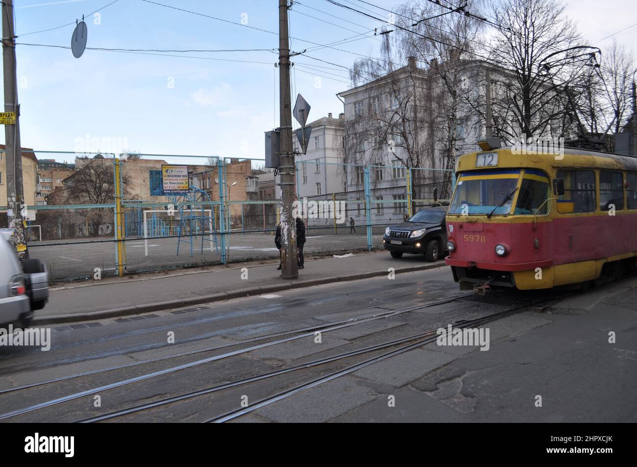 A Soviet-era red and yellow electric tram still operating in the Podil ...