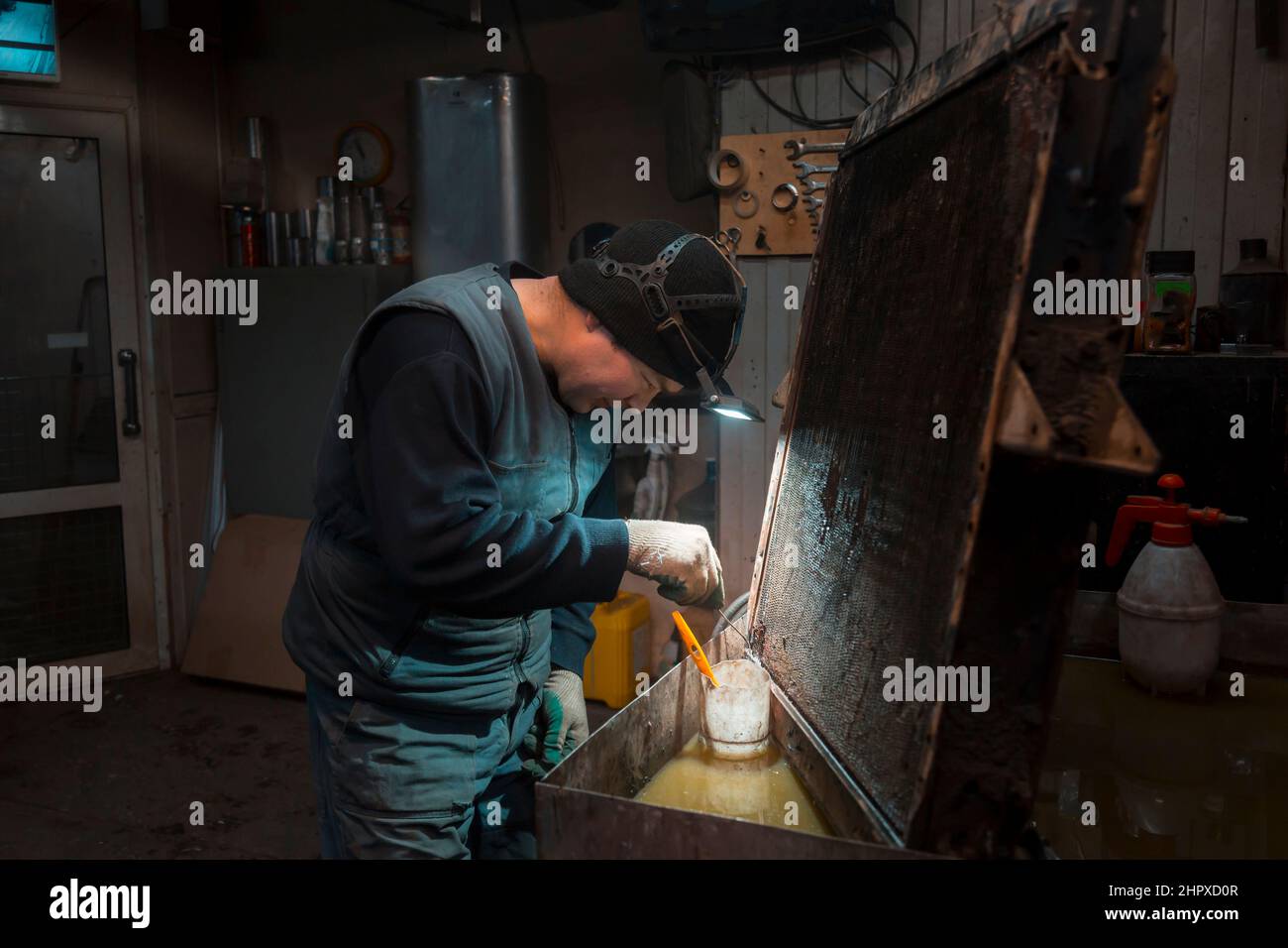Welding a large car radiator with a gas torch Stock Photo - Alamy