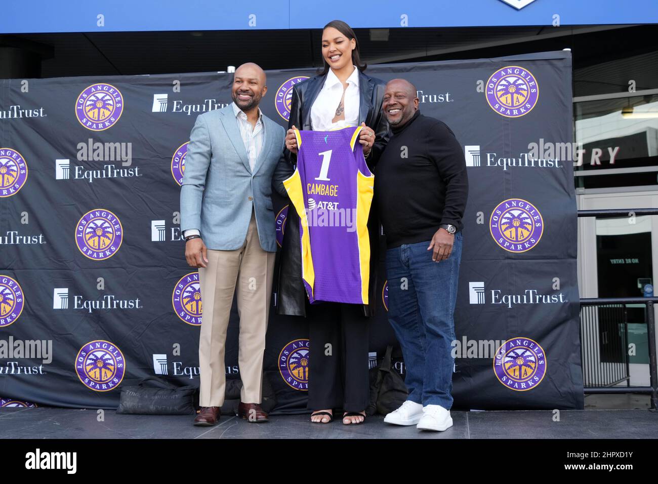 Liz Cambage (center) poses with Los Angeles Sparks general manager ...