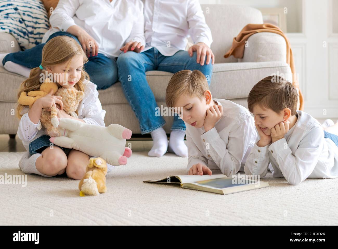 Parents watch children in room hi-res stock photography and images - Alamy