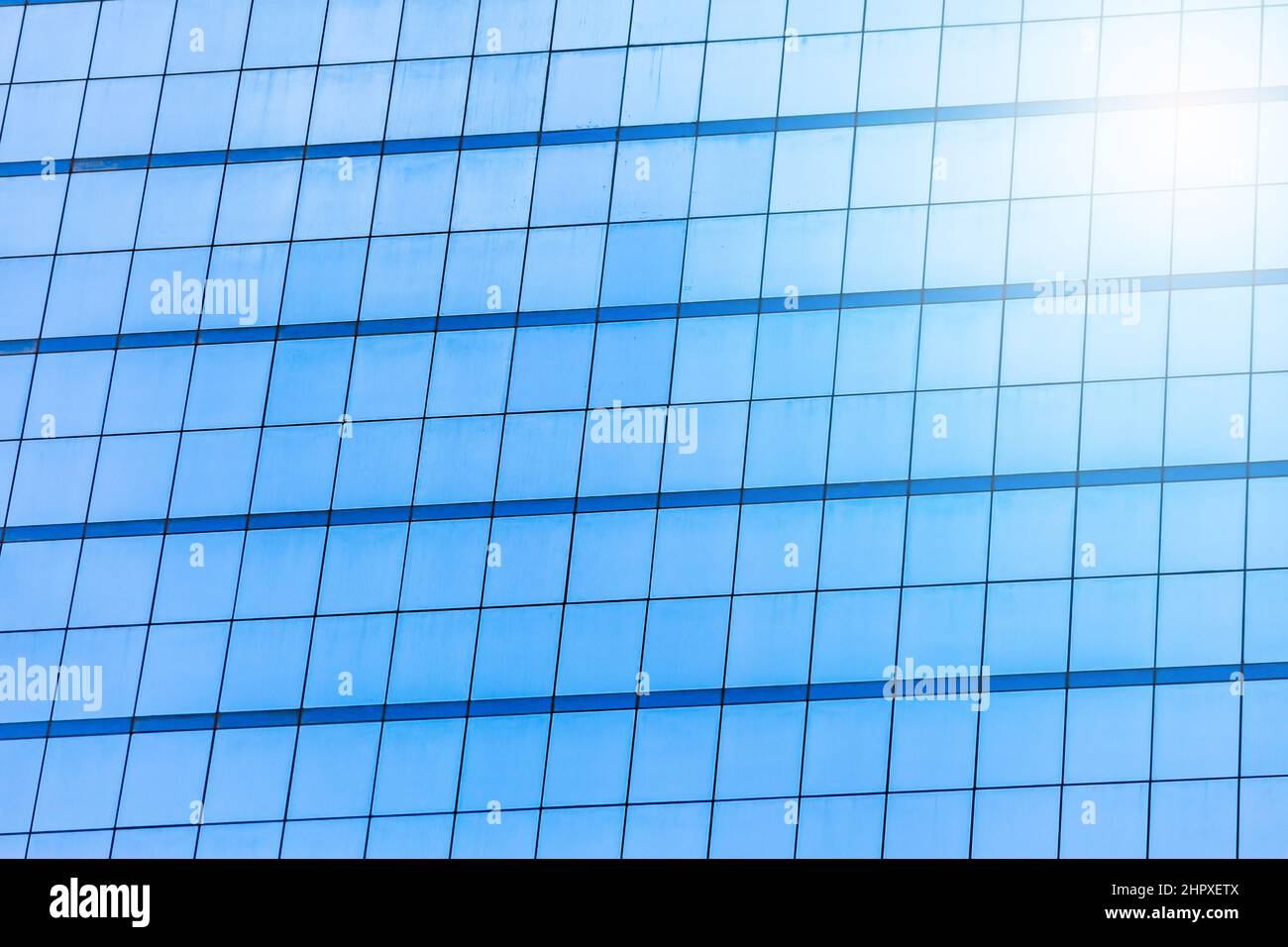 Blue glass windows of office building for background Stock Photo - Alamy