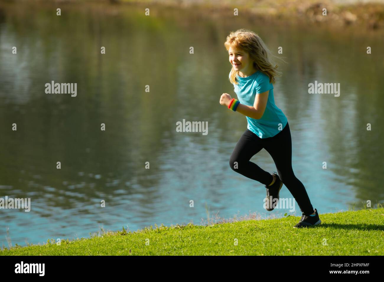 Boy jogging in park hi-res stock photography and images - Alamy