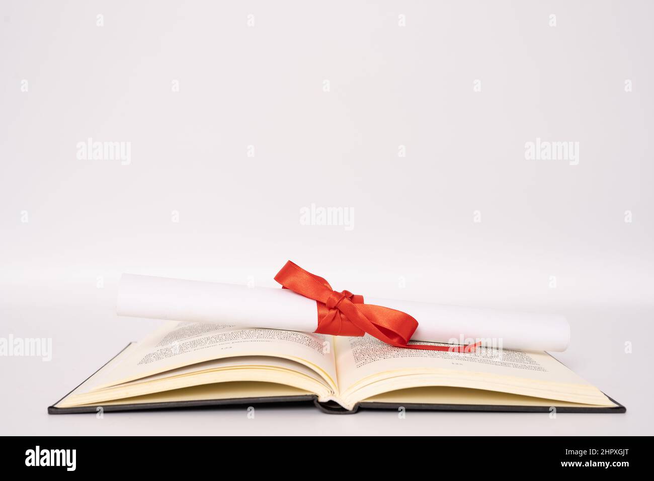 education, school, graduation and knowledge concept - close up of open ...