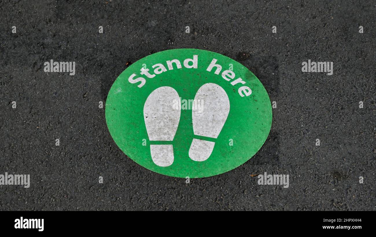 Stand Here sign painted on the pavement at a railway station in Albury ...
