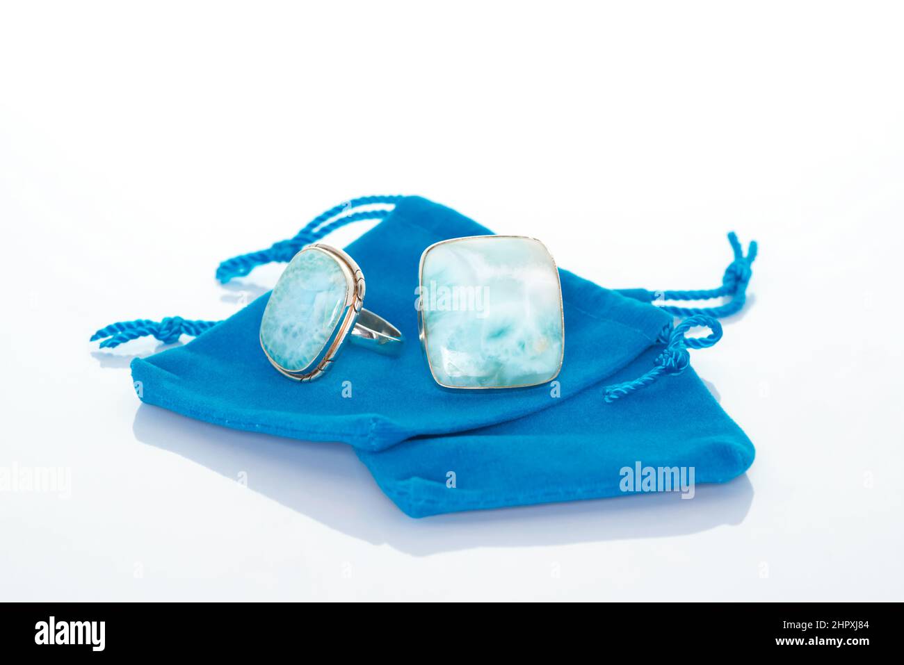 Blue larimar tumble gemstone ring on velvet bag. Collection of natural ...