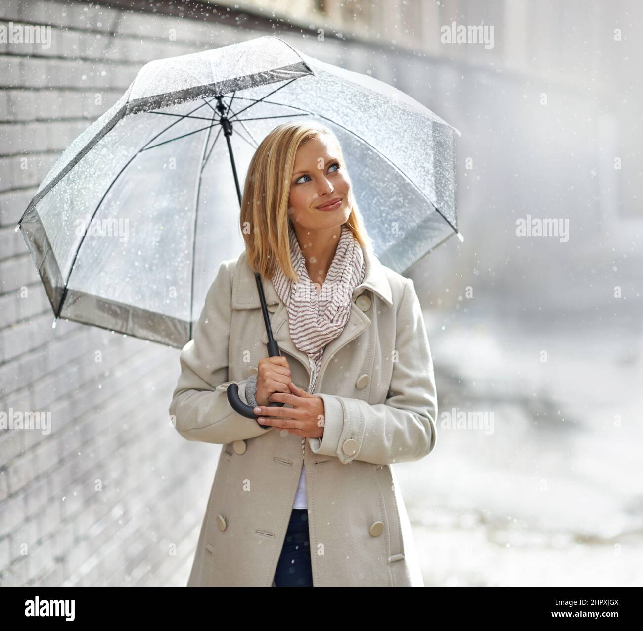 Girl Walking In The Rain With Umbrella