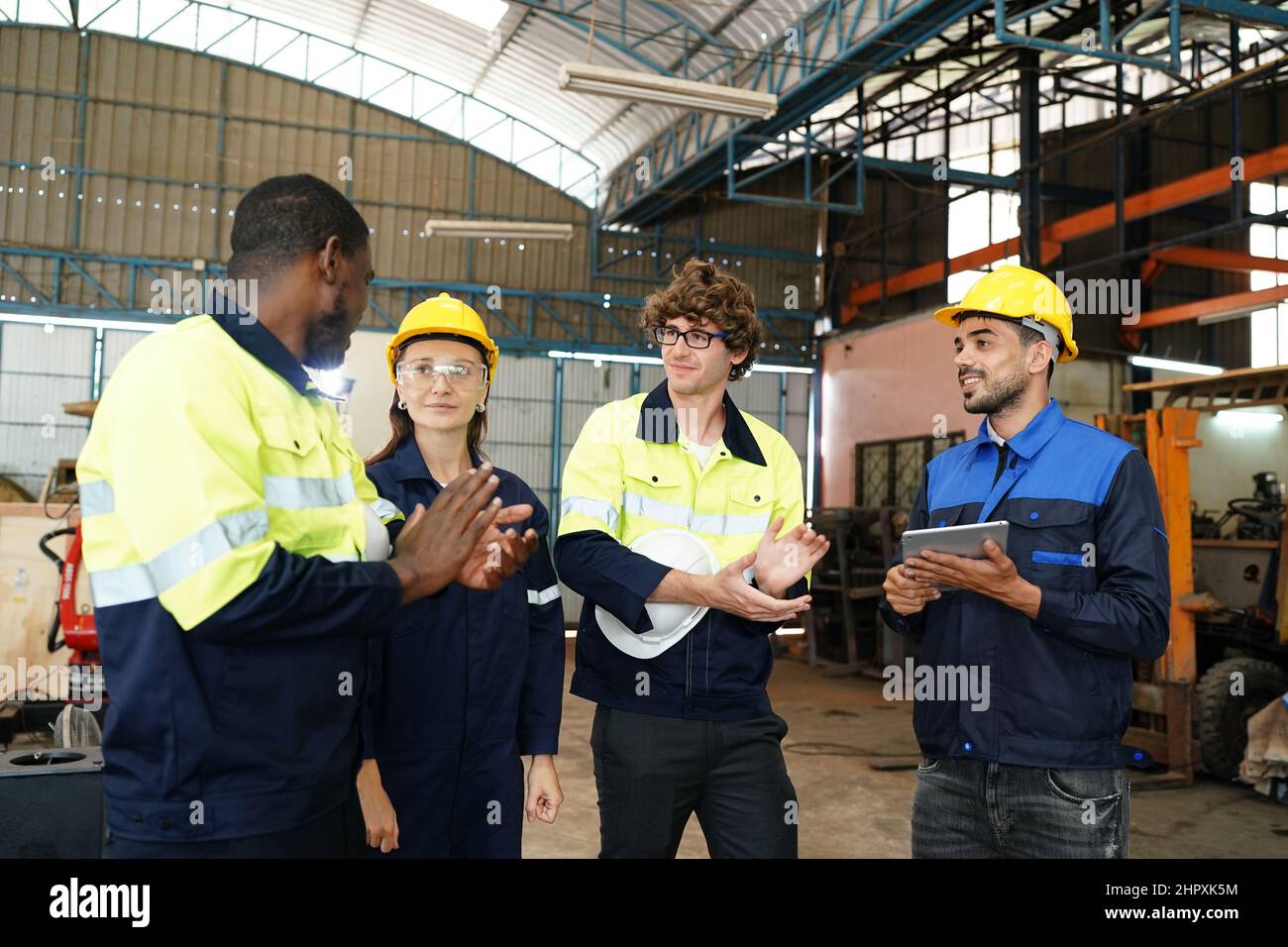 Factory workers operating equipment hi-res stock photography and images ...