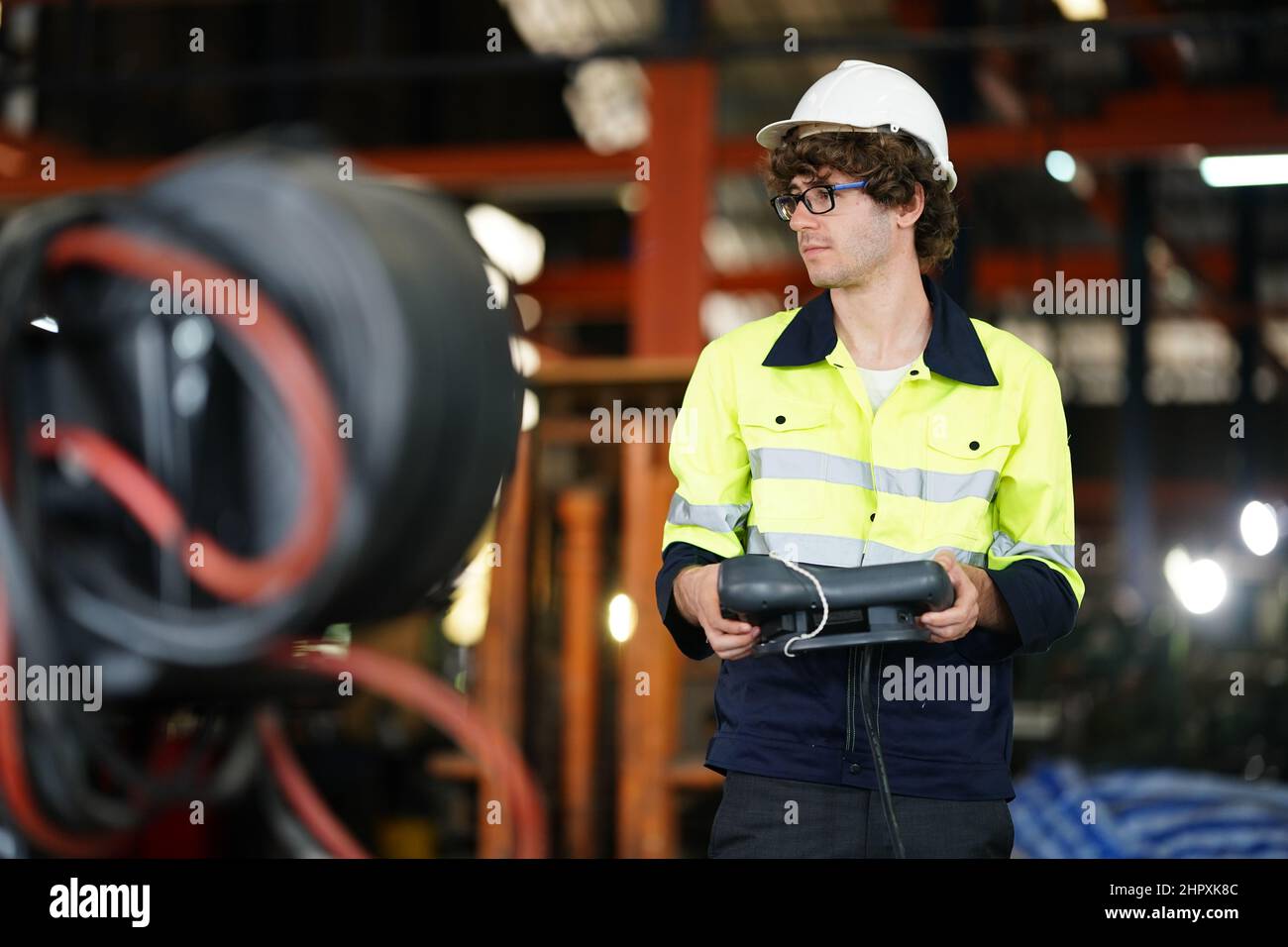 engineer checking control panel and teaching new Automatics robot arm ...