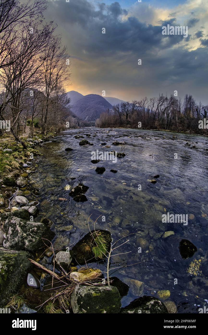Piles of stones are visible inside the clear water Stock Photo - Alamy
