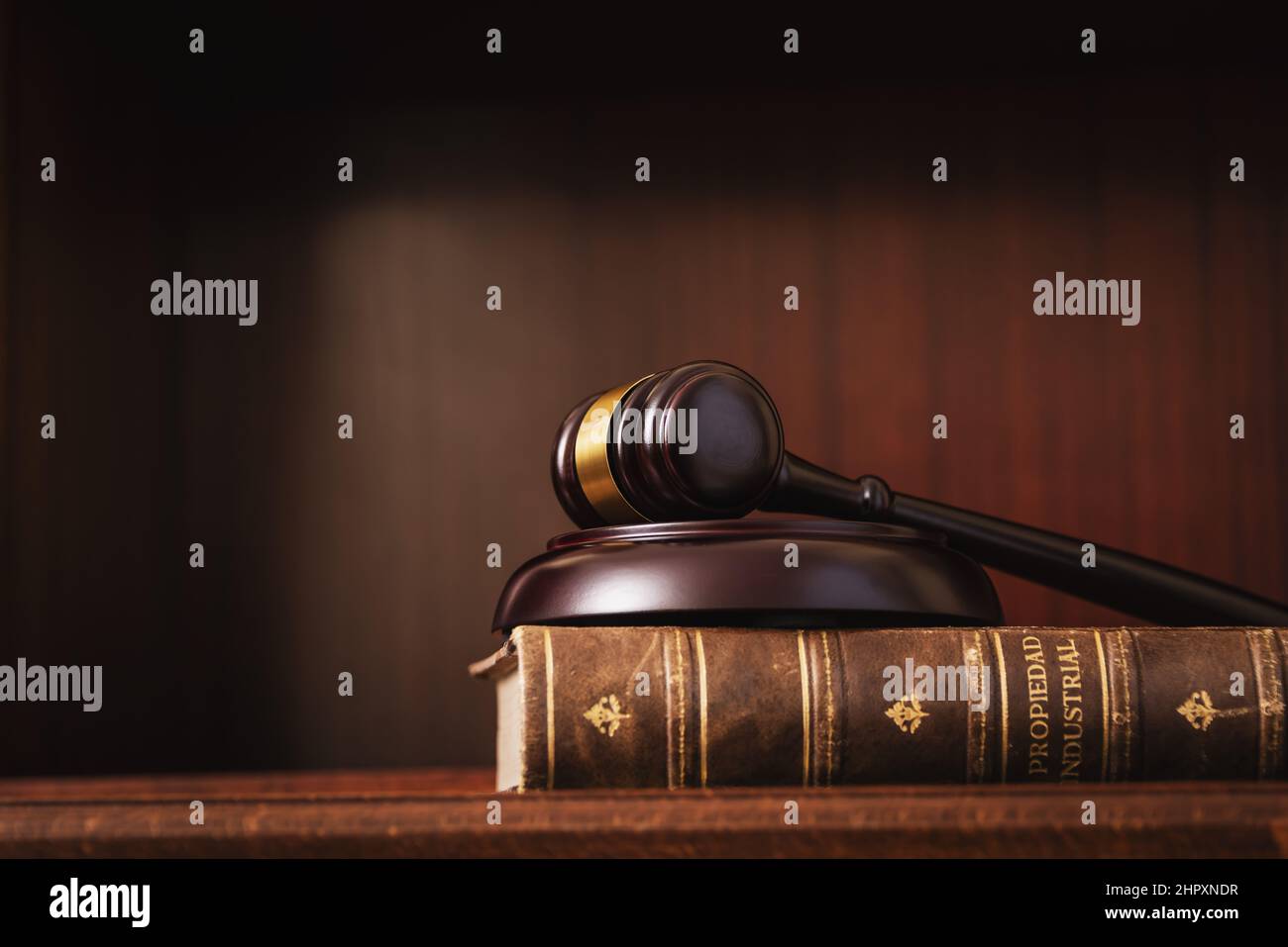 studio picture of a judge's hammer on wooden background Stock Photo - Alamy