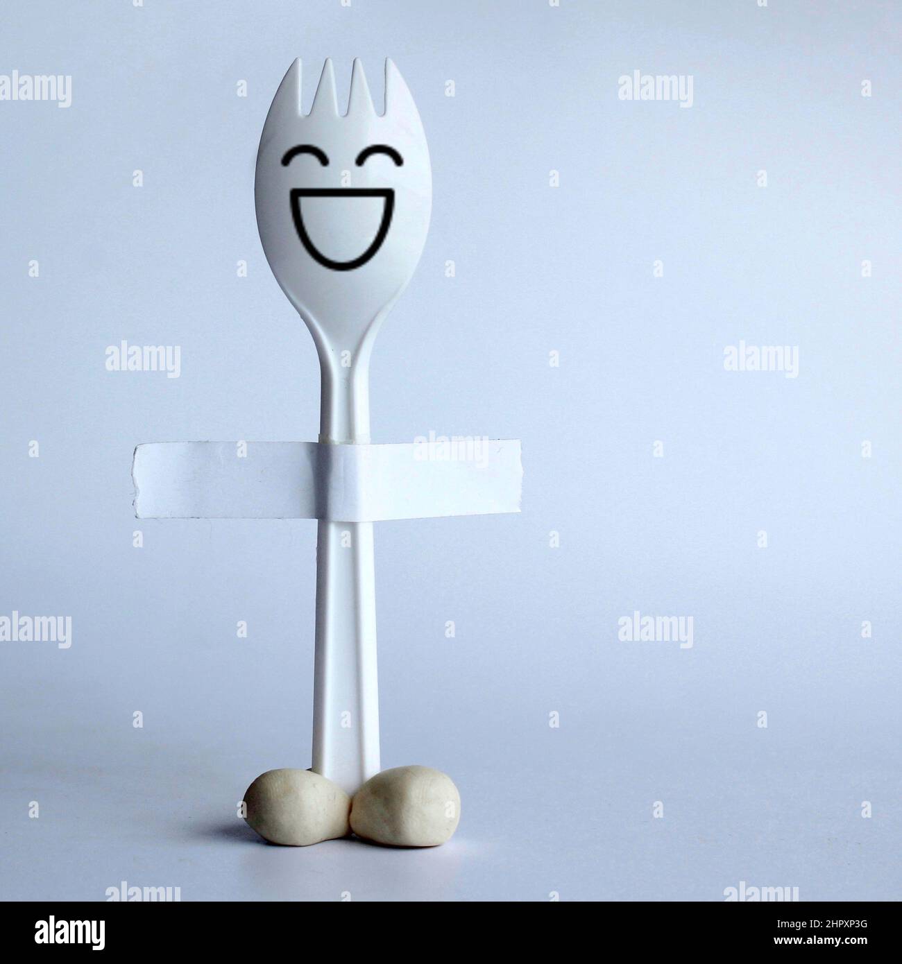 White fork with smiley face on white background with copy space Stock ...