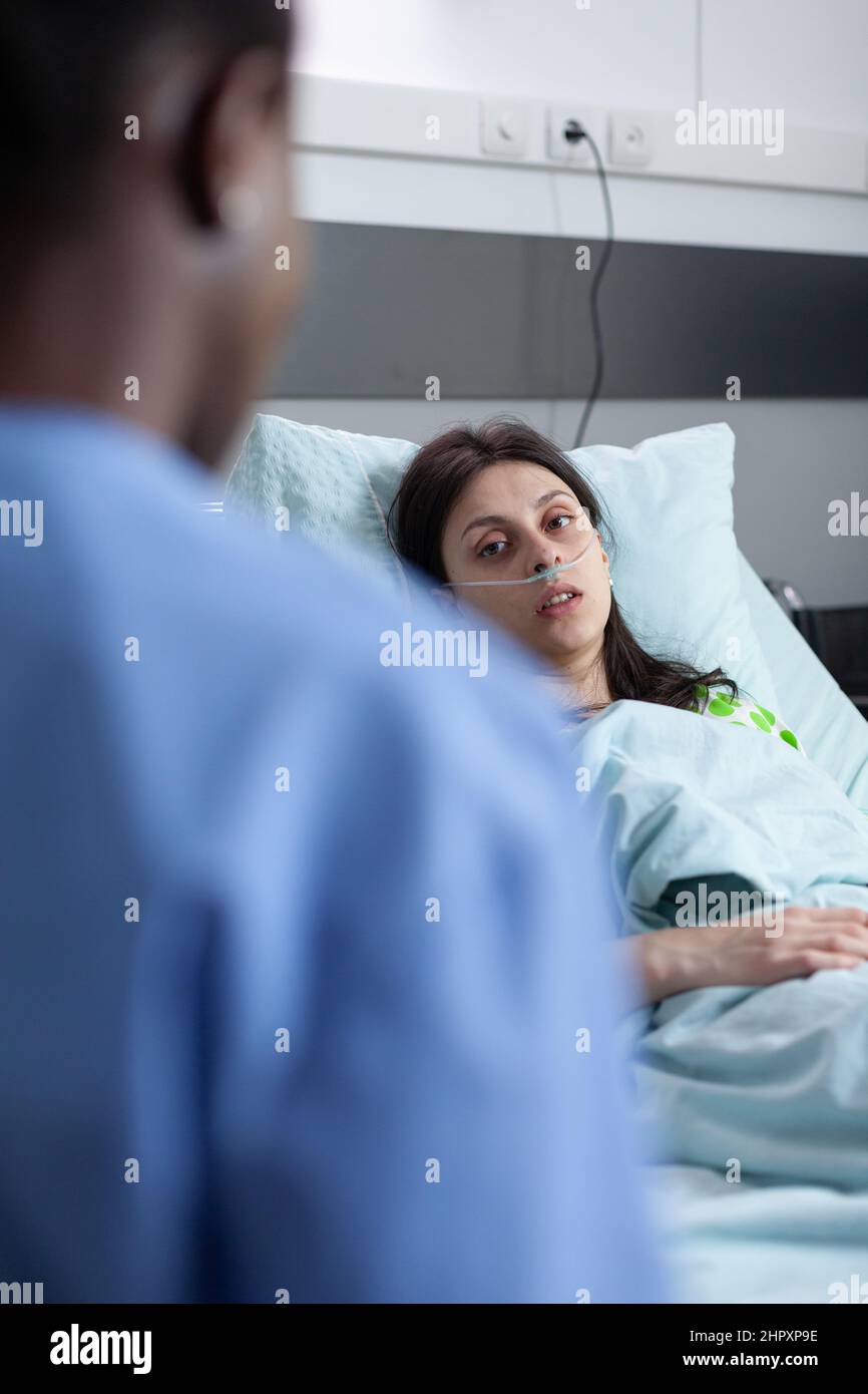 Woman with illness having low spo2 saturation in private ward looking ...