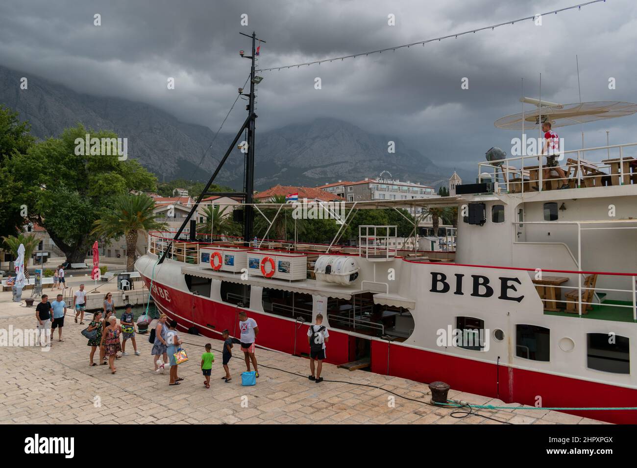 Tourist boat in the port of Baska Voda in Croatia Stock Photo - Alamy