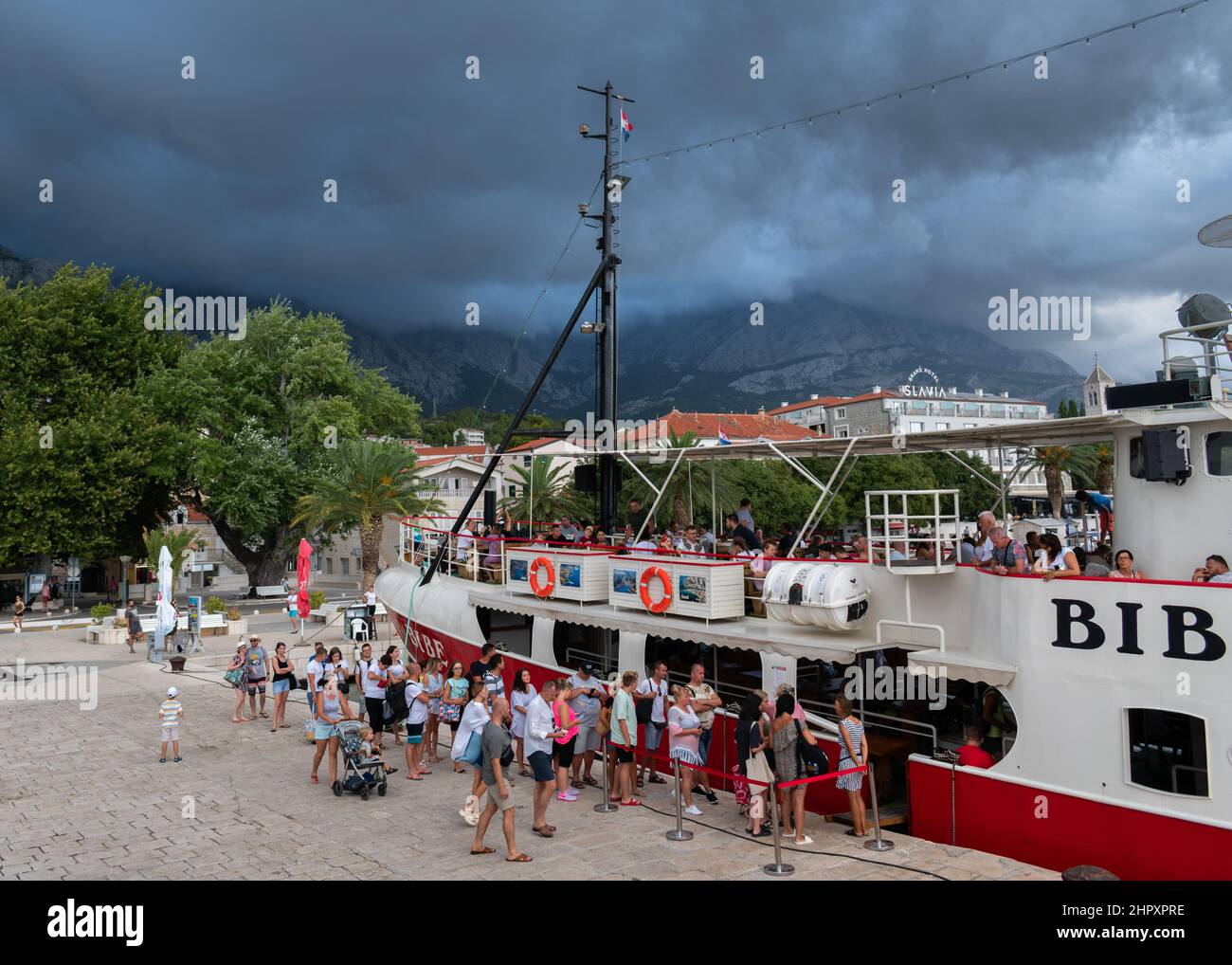 Tourist boat in the port of Baska Voda in Croatia Stock Photo - Alamy