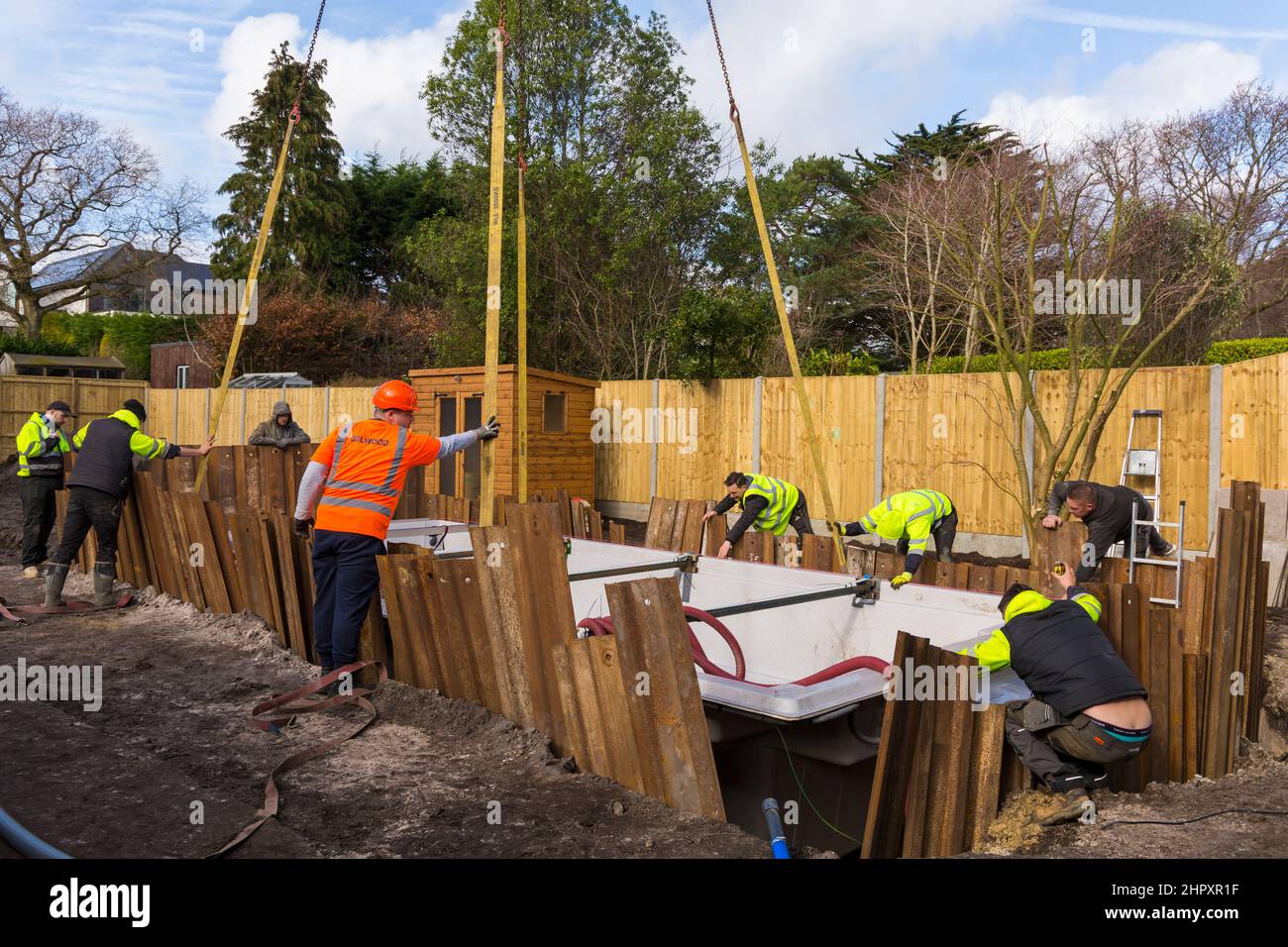 Swimming pool installation - lowering the pool into position Stock ...