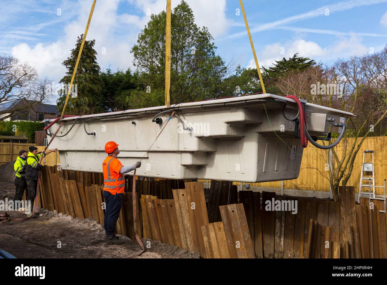 Swimming pool installation - lowering the pool into position Stock ...
