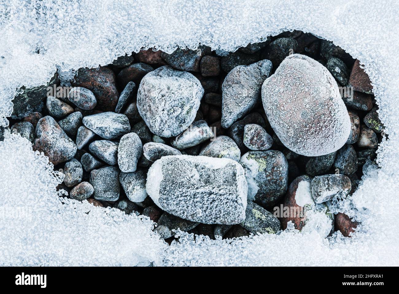 Frozen stones on shoreline, Sweden Stock Photo - Alamy