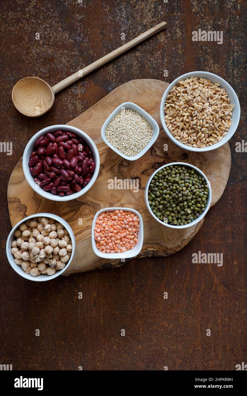 Variety of uncooked superfood cereals, chia, red lentils, pearl spelled ...