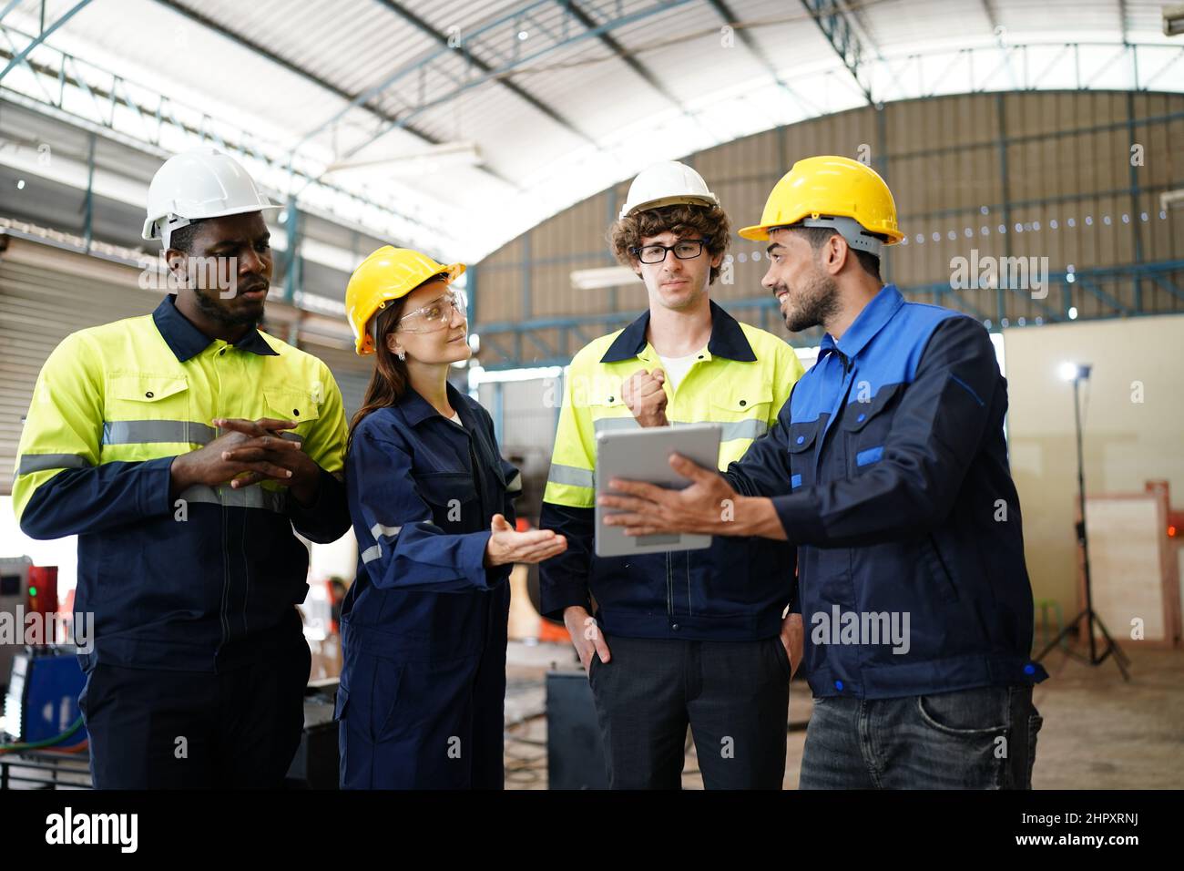engineer checking control panel and teaching new Automatics robot arm ...
