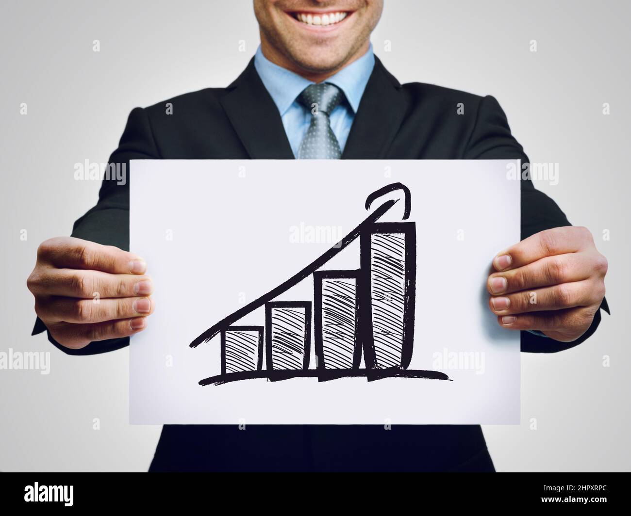 The numbers are in. Cropped shot of a businessman holding up a hand ...