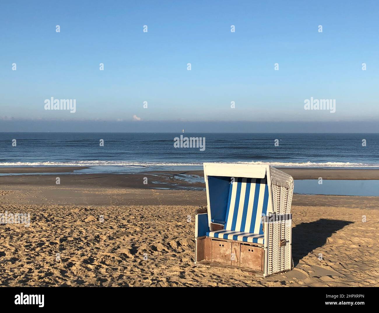 typical german hooded beach chair at the sandy beach in Sylt without ...