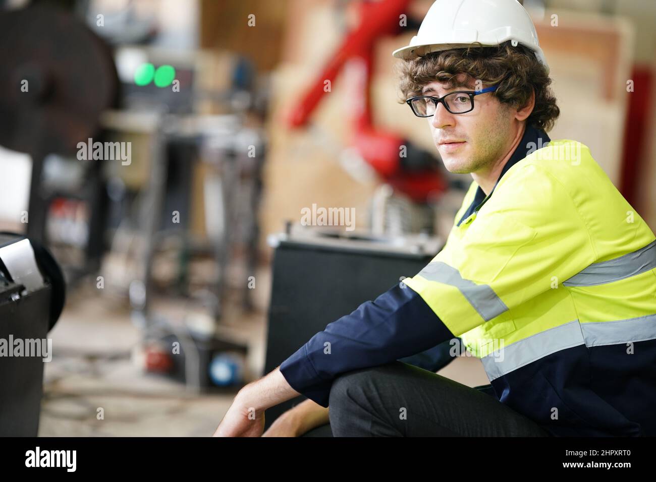 engineer checking control panel and teaching new Automatics robot arm ...