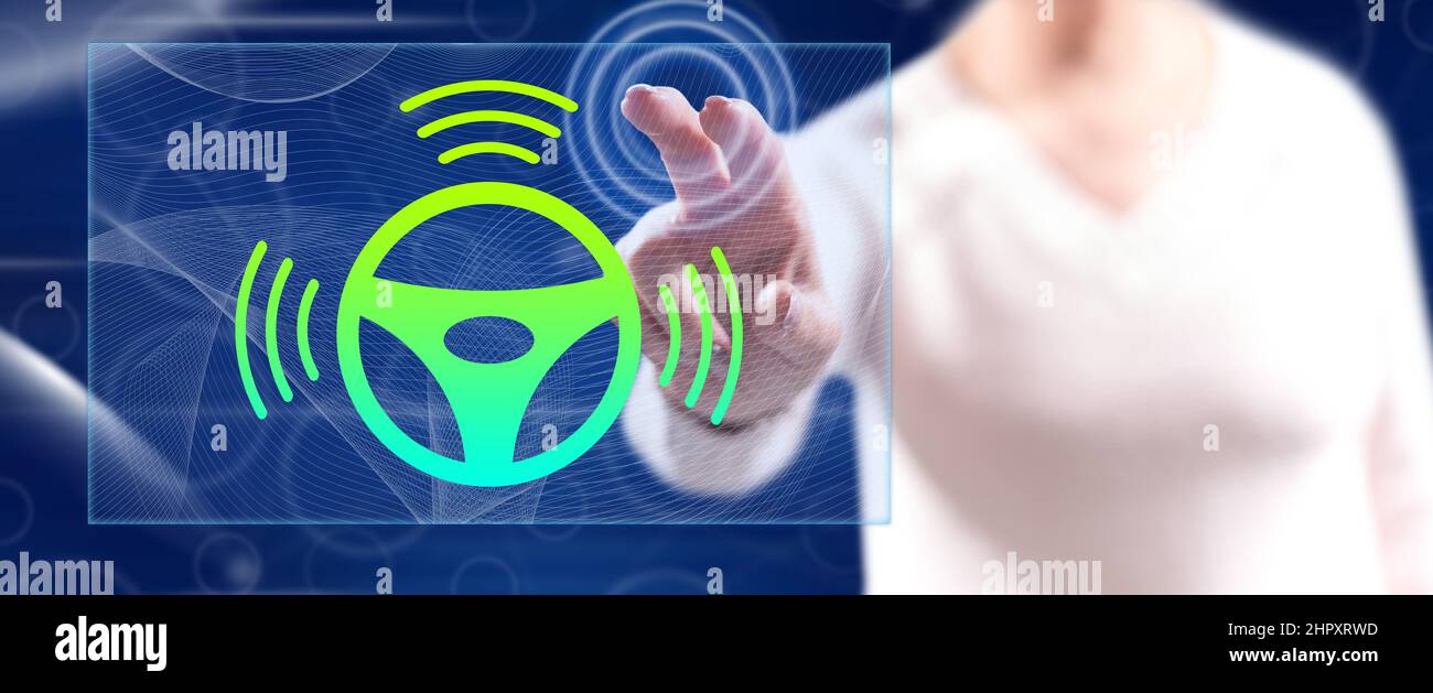 Woman touching a self-driving car concept on a touch screen with her ...