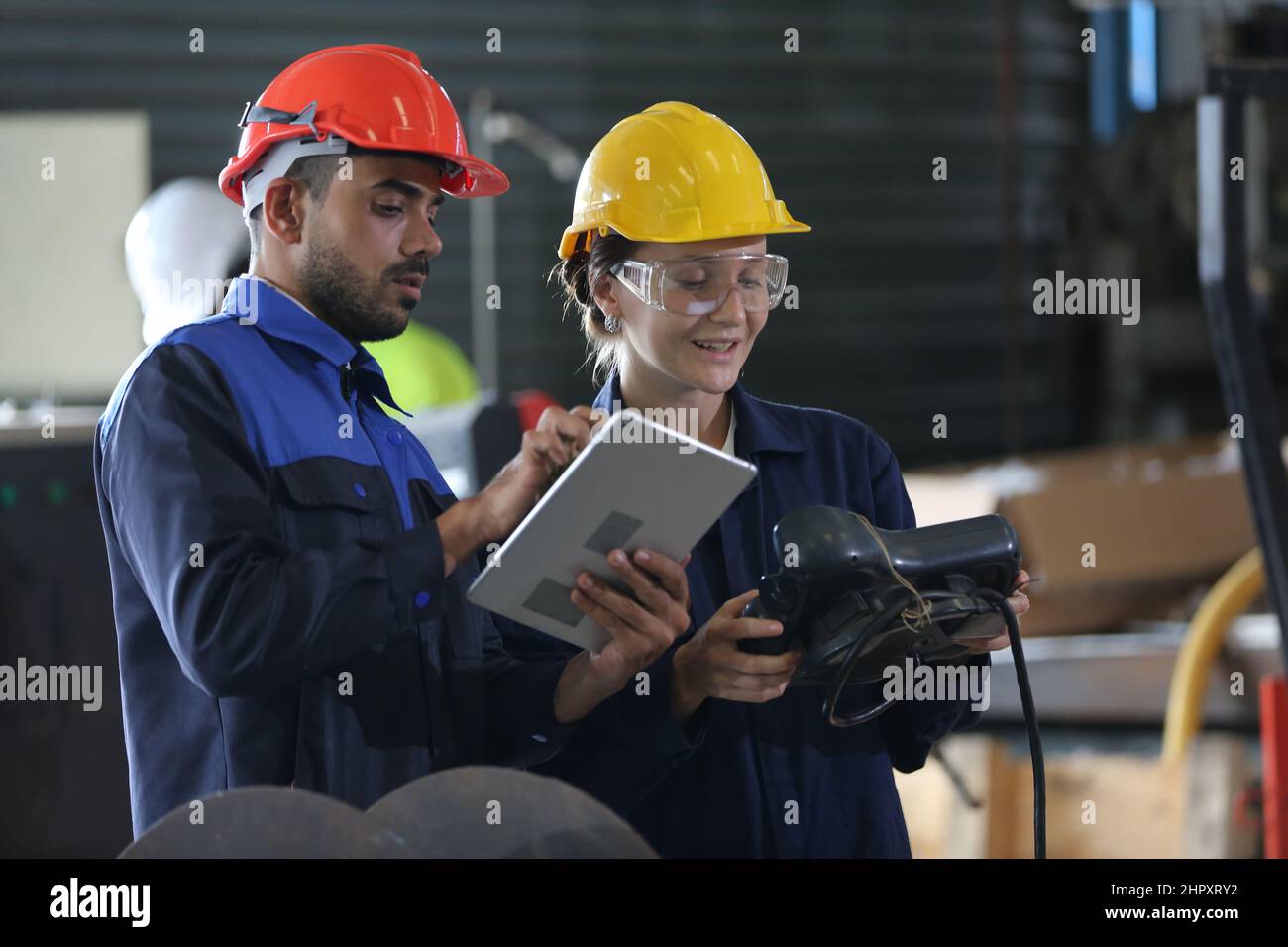 Factory Engineer Operating machines in industry factory Stock Photo - Alamy