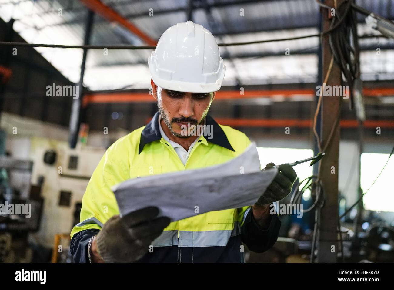 engineer checking control panel and teaching new Automatics robot arm ...