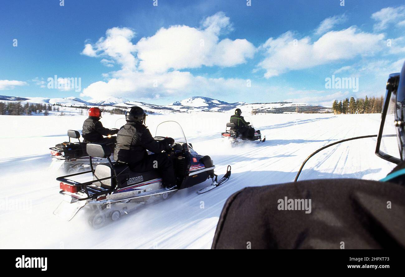 Snowmobiling in Yellowstone National Park Montana USA Stock Photo - Alamy
