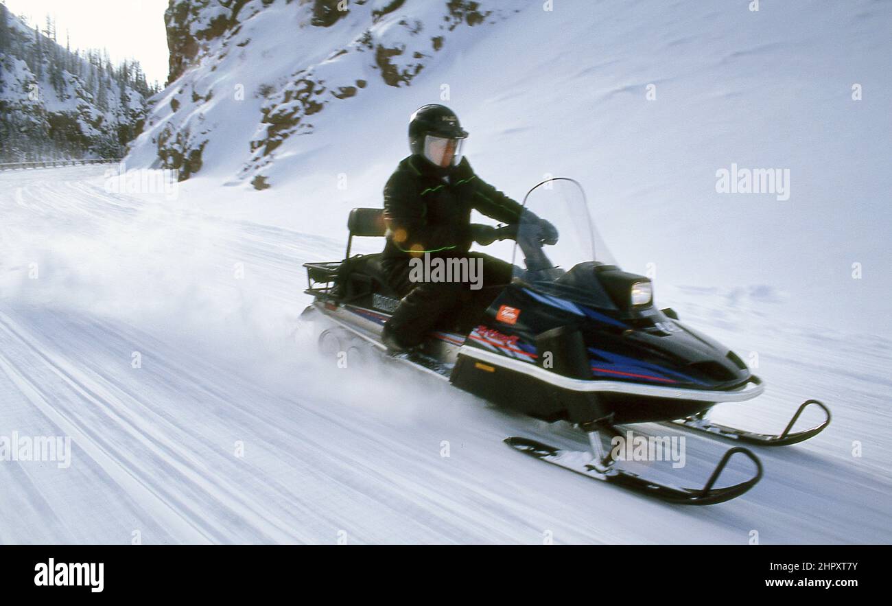 Snowmobiling in Yellowstone National Park Montana USA Stock Photo - Alamy