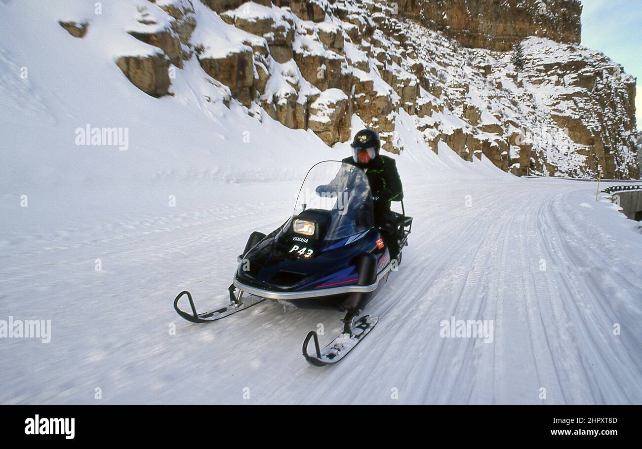 Snowmobiling in Yellowstone National Park Montana USA Stock Photo - Alamy
