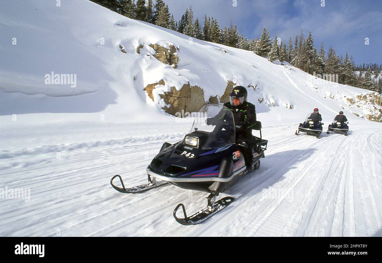 Snowmobiling in Yellowstone National Park Montana USA Stock Photo - Alamy