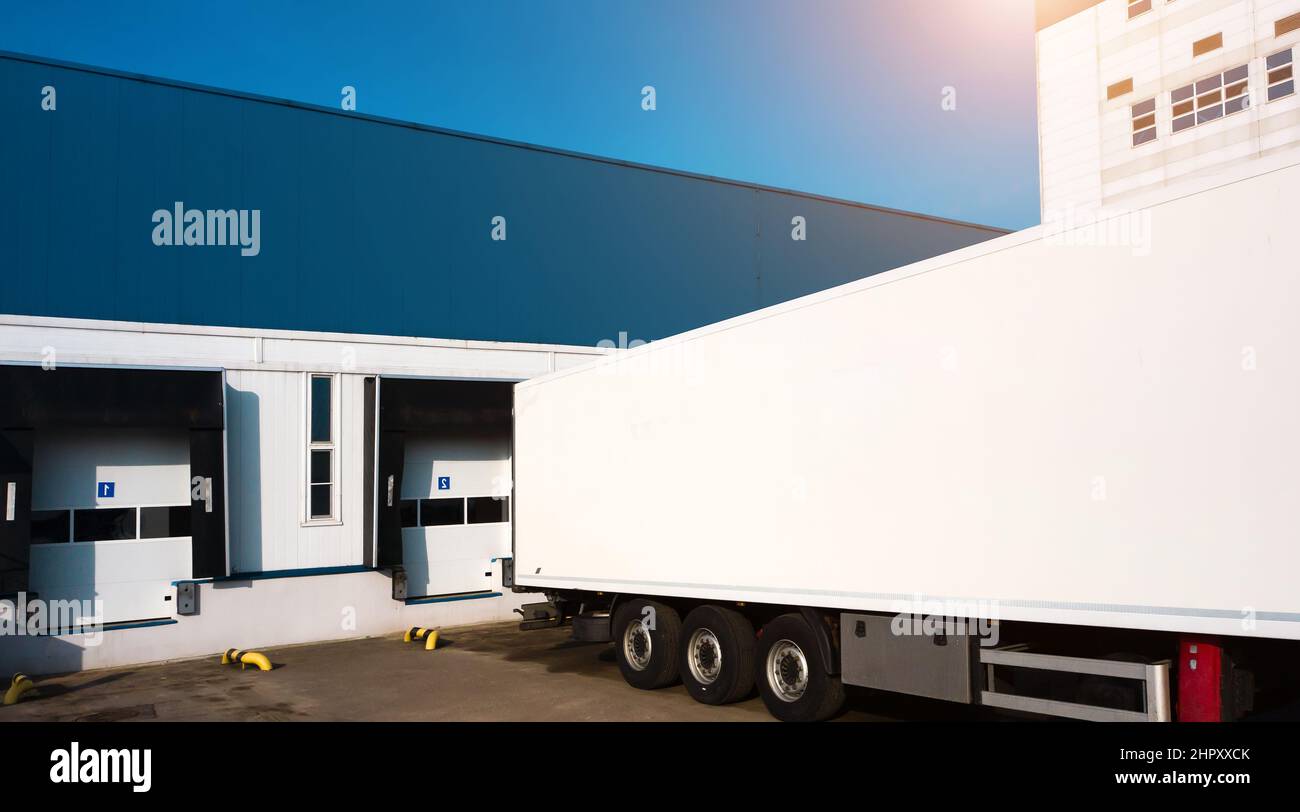 The truck is parked for loading on the ramp. Cargo Transportation By ...