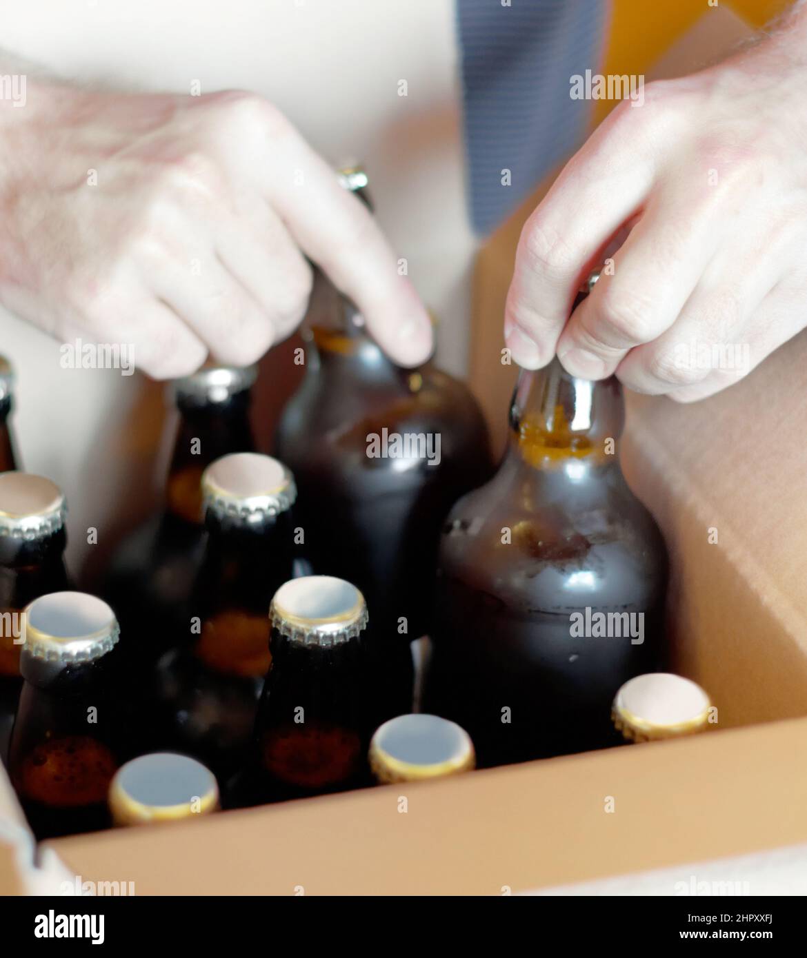 Lets get these boys ready for a party. Shot of bottled beer being boxed ...