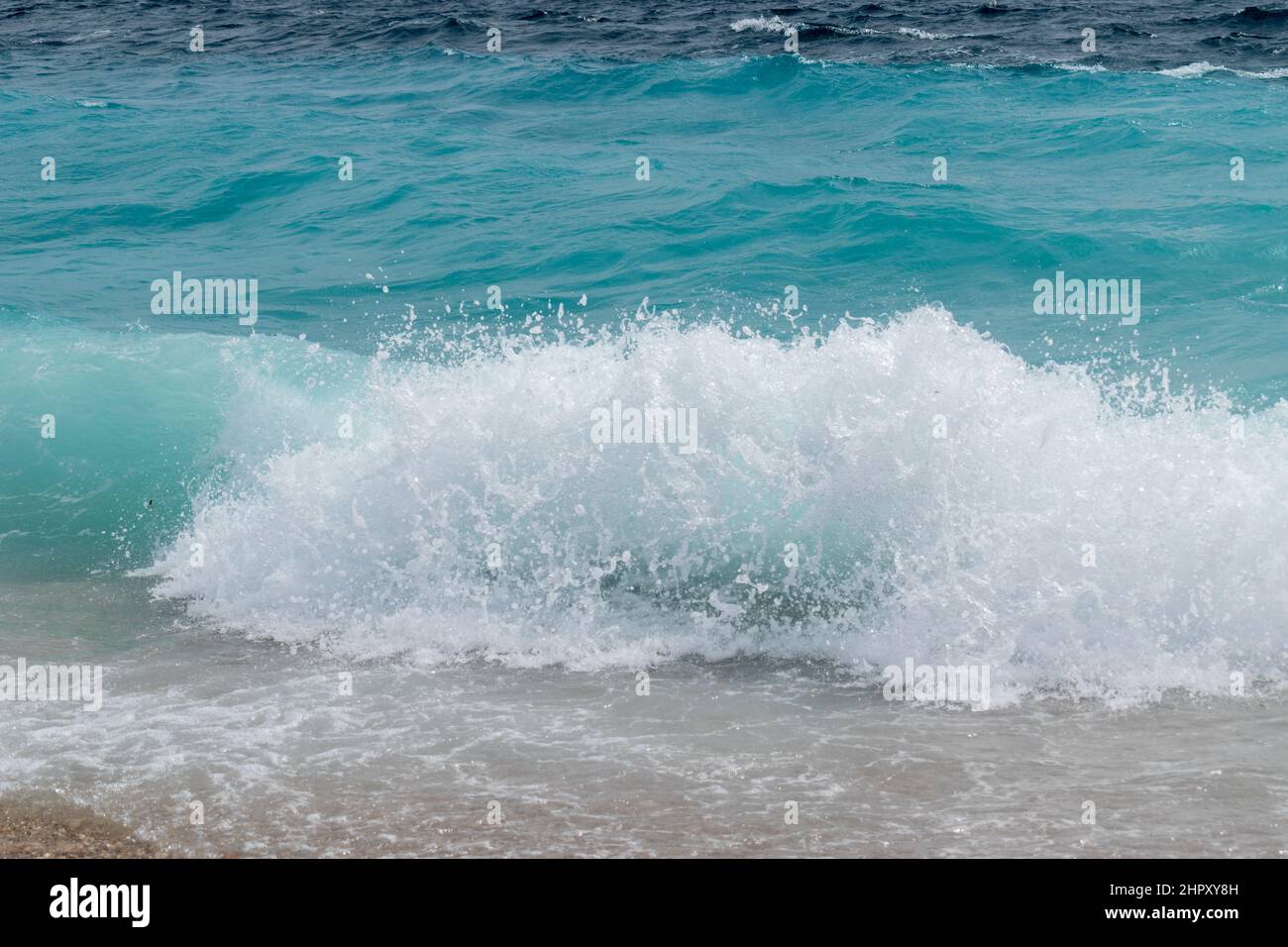 Wavy sea on the beach Zlatni rat near Bol town on the island of Brac in ...