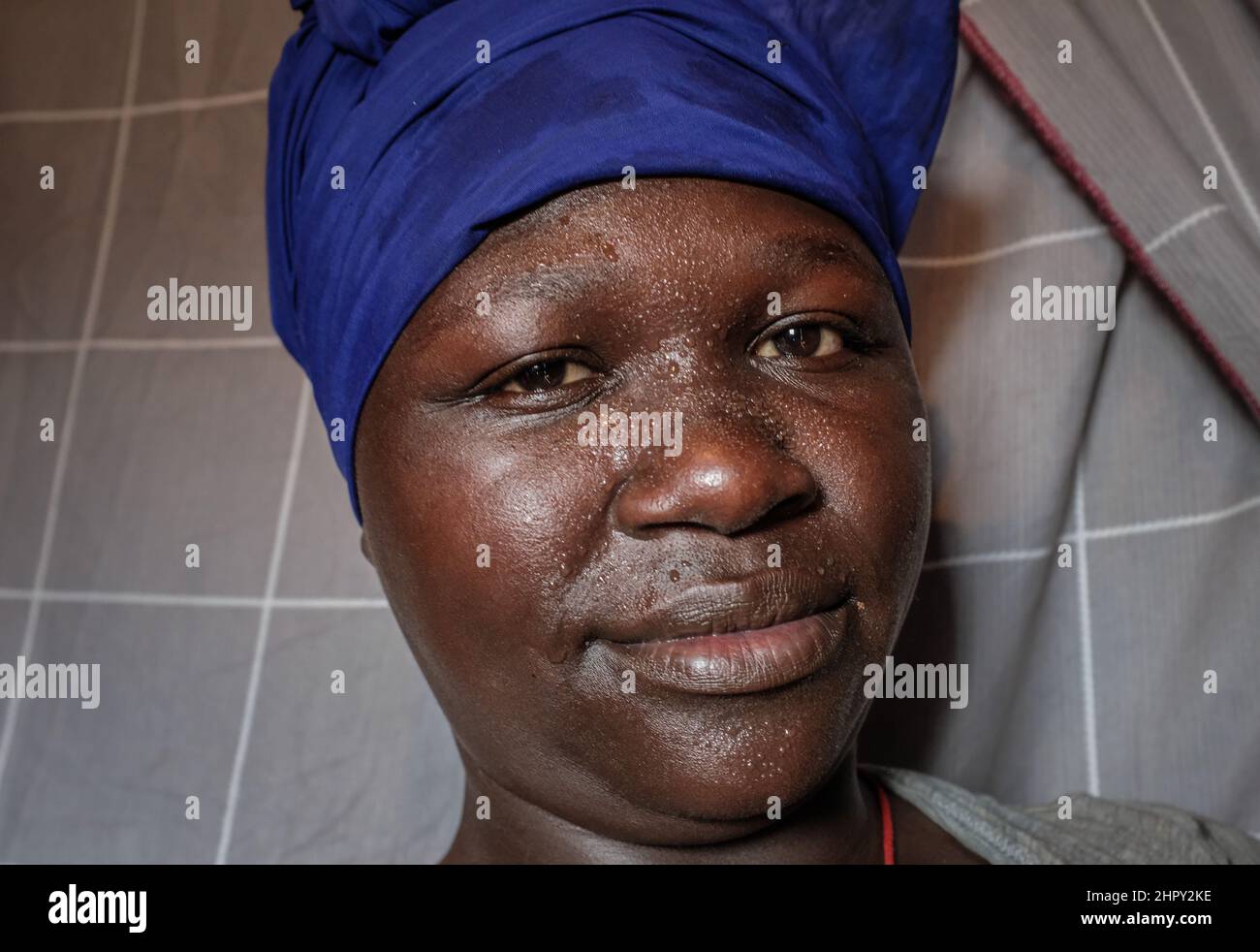 A portrait of 22 year old Elpha Atieno during a food drive in Kibera ...
