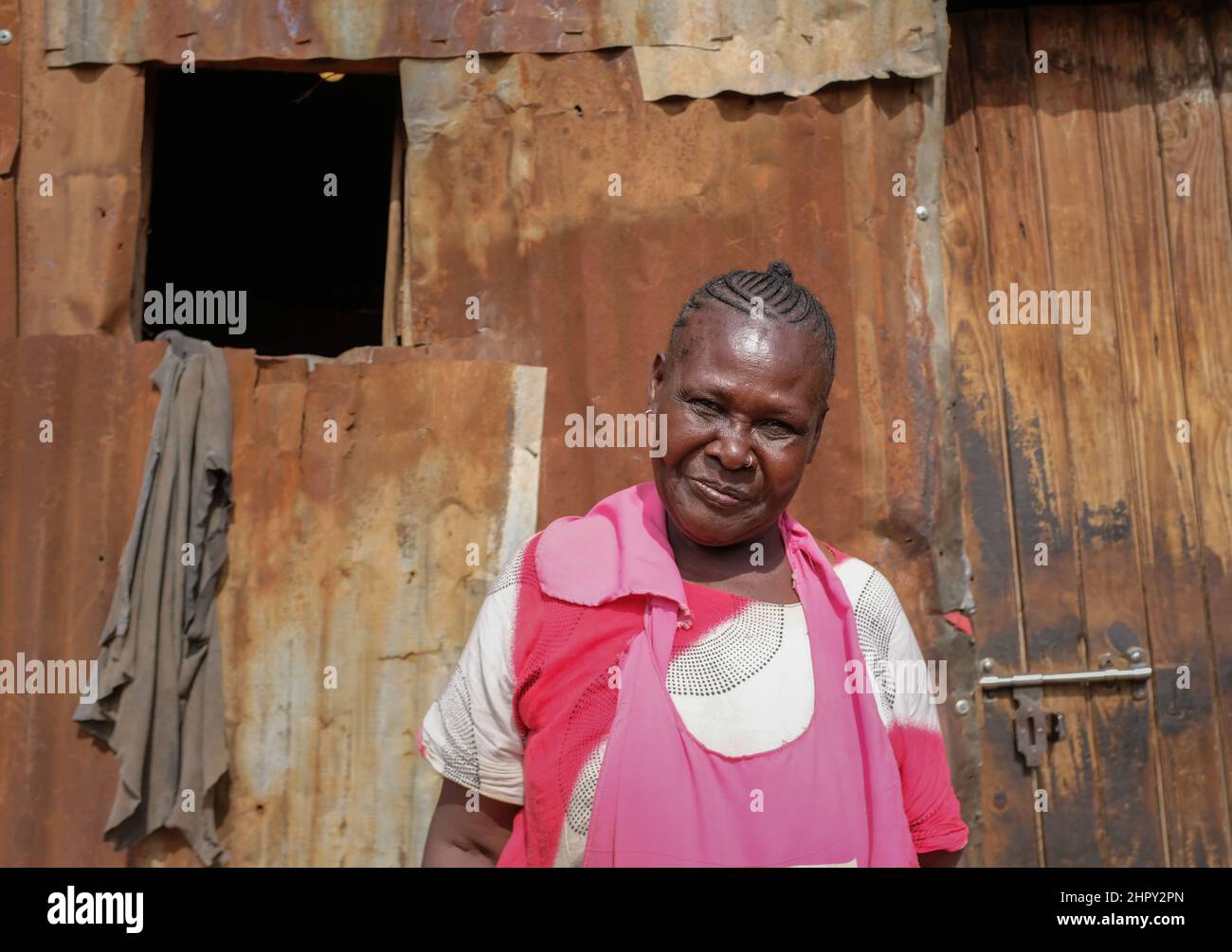 A portrait of Ruth Atieno outside her home in Kibera Slums Stock Photo ...