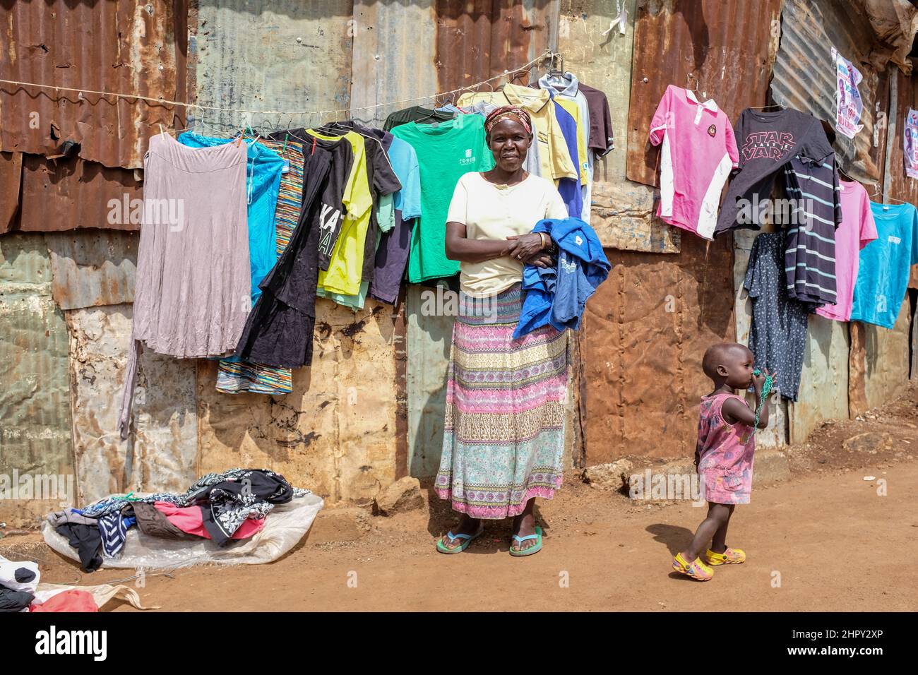 A woman sell second hand clothes by the streets in Kibera Slums Stock ...