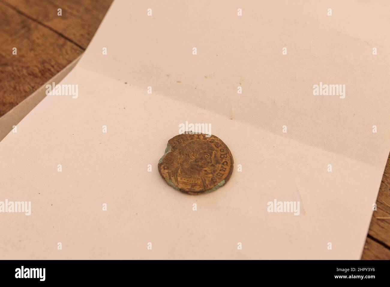 Breisach, Germany. 23rd Feb, 2022. A Roman copper coin with the ...