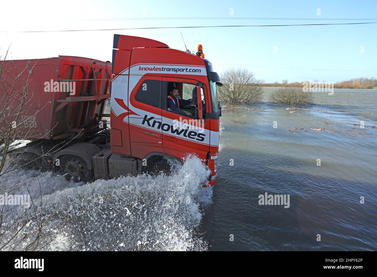 Sutton Gault, UK. 22nd Feb, 2022. A truck battles through floodwater as ...