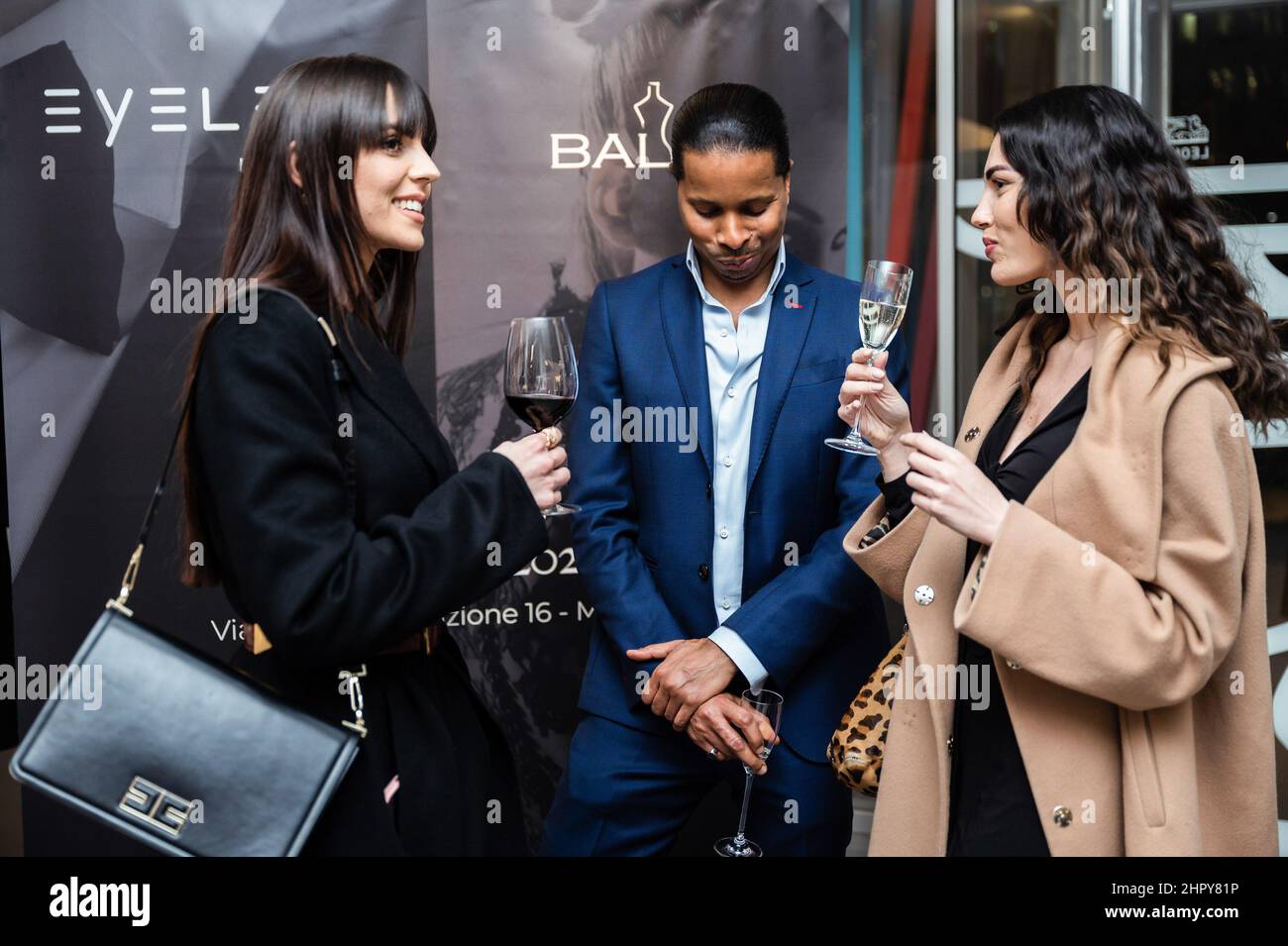 Designer Balde (C) seen smiling with guests. Iconic dresses of Atelier ...