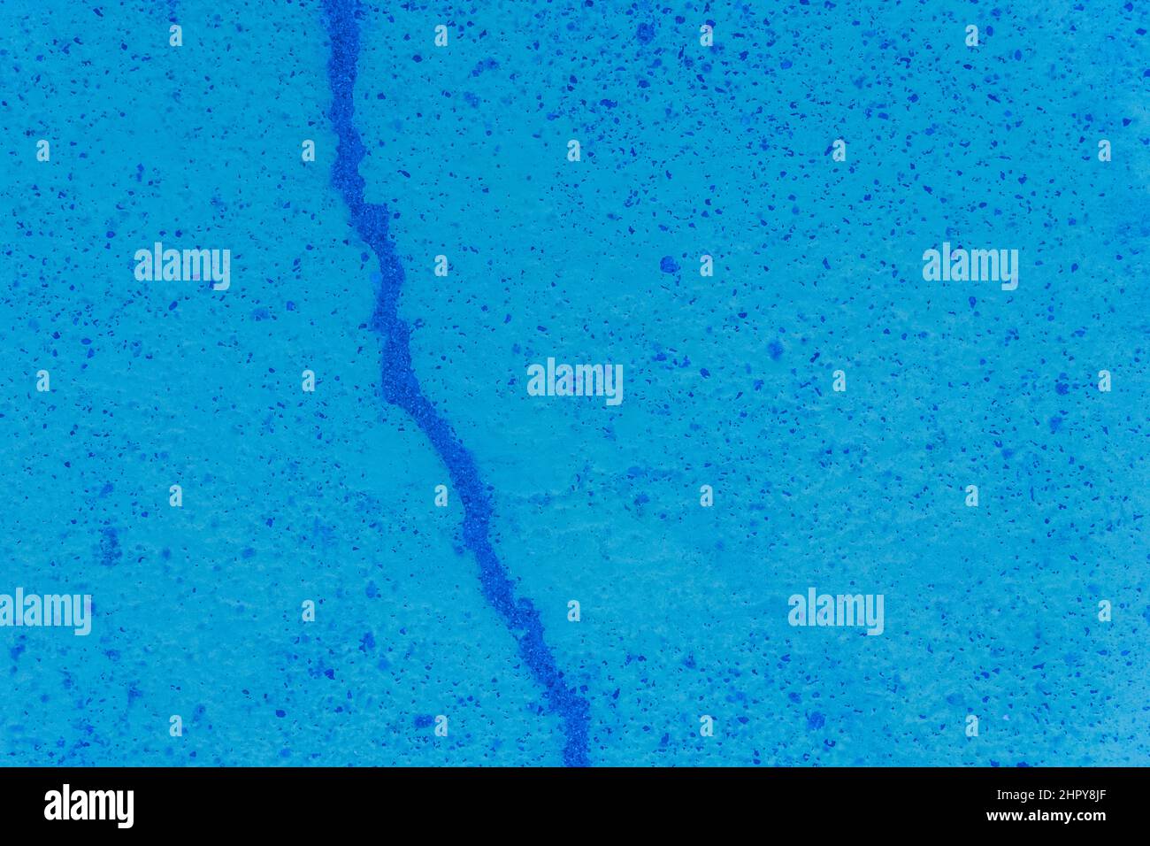 Crack on blue paint concrete surface weathered cement worn texture ...