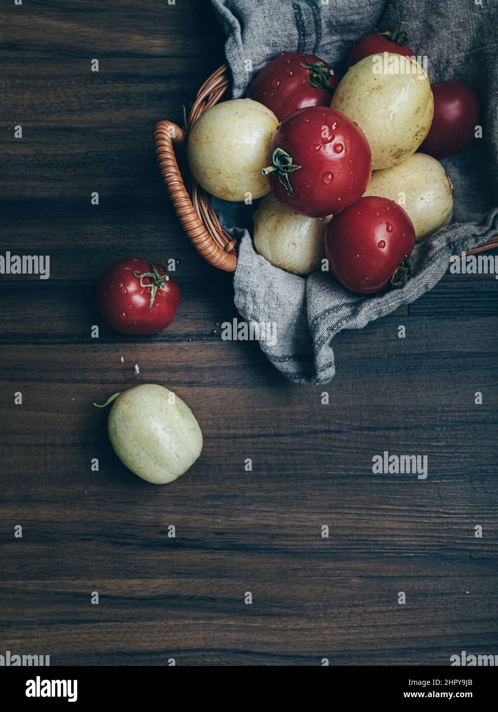 Flat lay of different kinds of fresh vegetables in a wicker basket on a ...