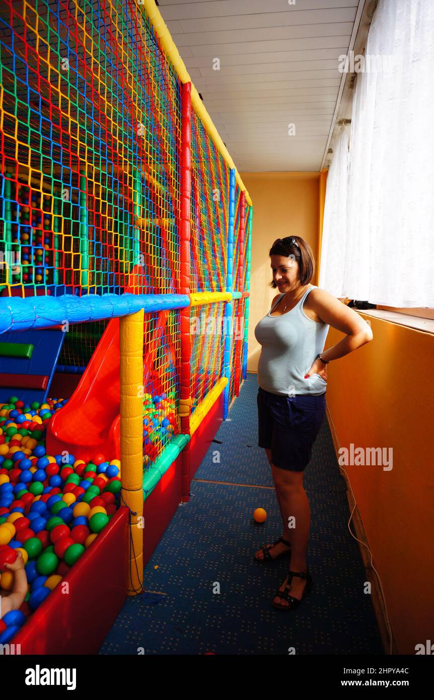 Mother watching child playground hi-res stock photography and images ...