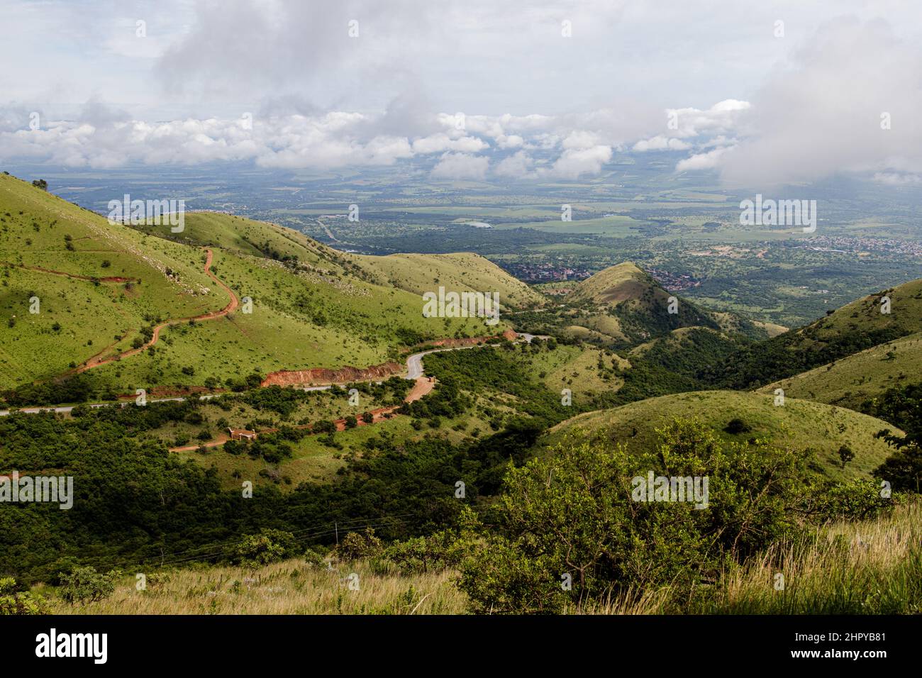 Magnificant view of green hills under cloudy sky Stock Photo - Alamy
